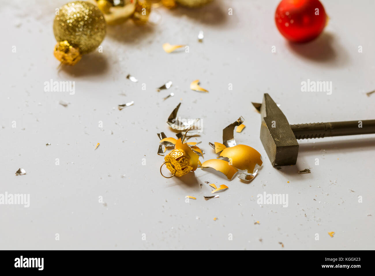 Shattered Christmas ball with hammer - anti christmas Stock Photo - Alamy