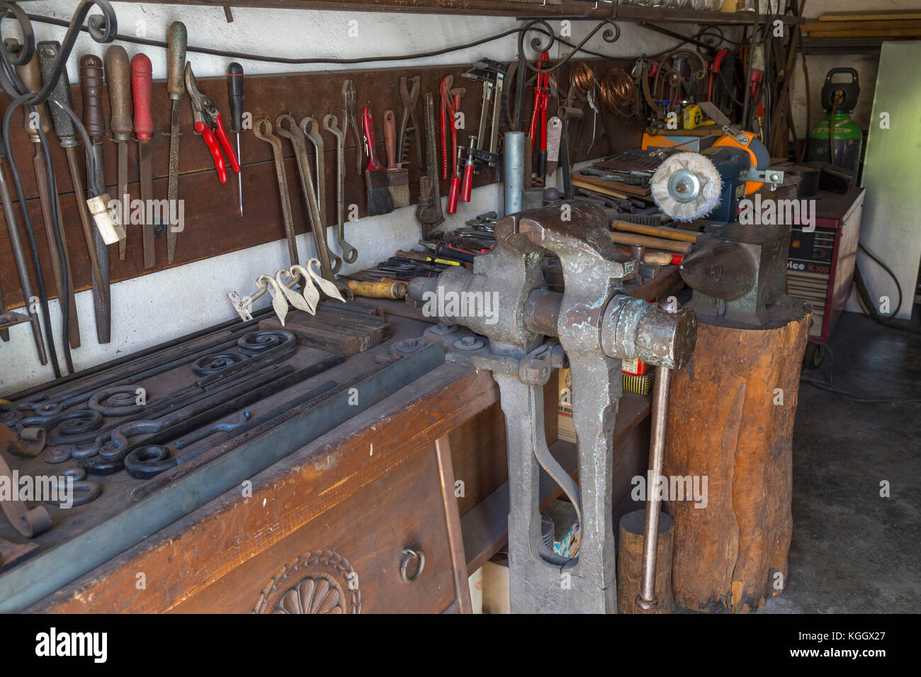 Tools and workbench in a traditional ironmongery workshop Stock Photo ...