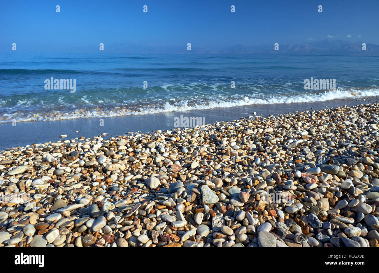 Pebbles on a sandy beach on the island of Corfu Stock Photo - Alamy