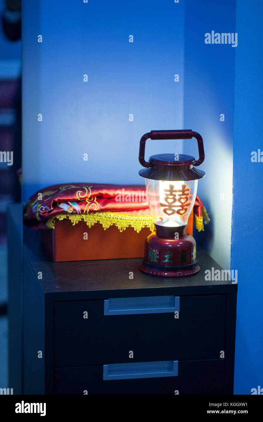 holding Chinese LED lantern lamp with golden Chinese double happiness ...