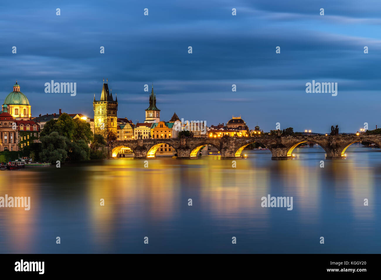 View of the Vltava River and the bridges shined with the sunset sun ...