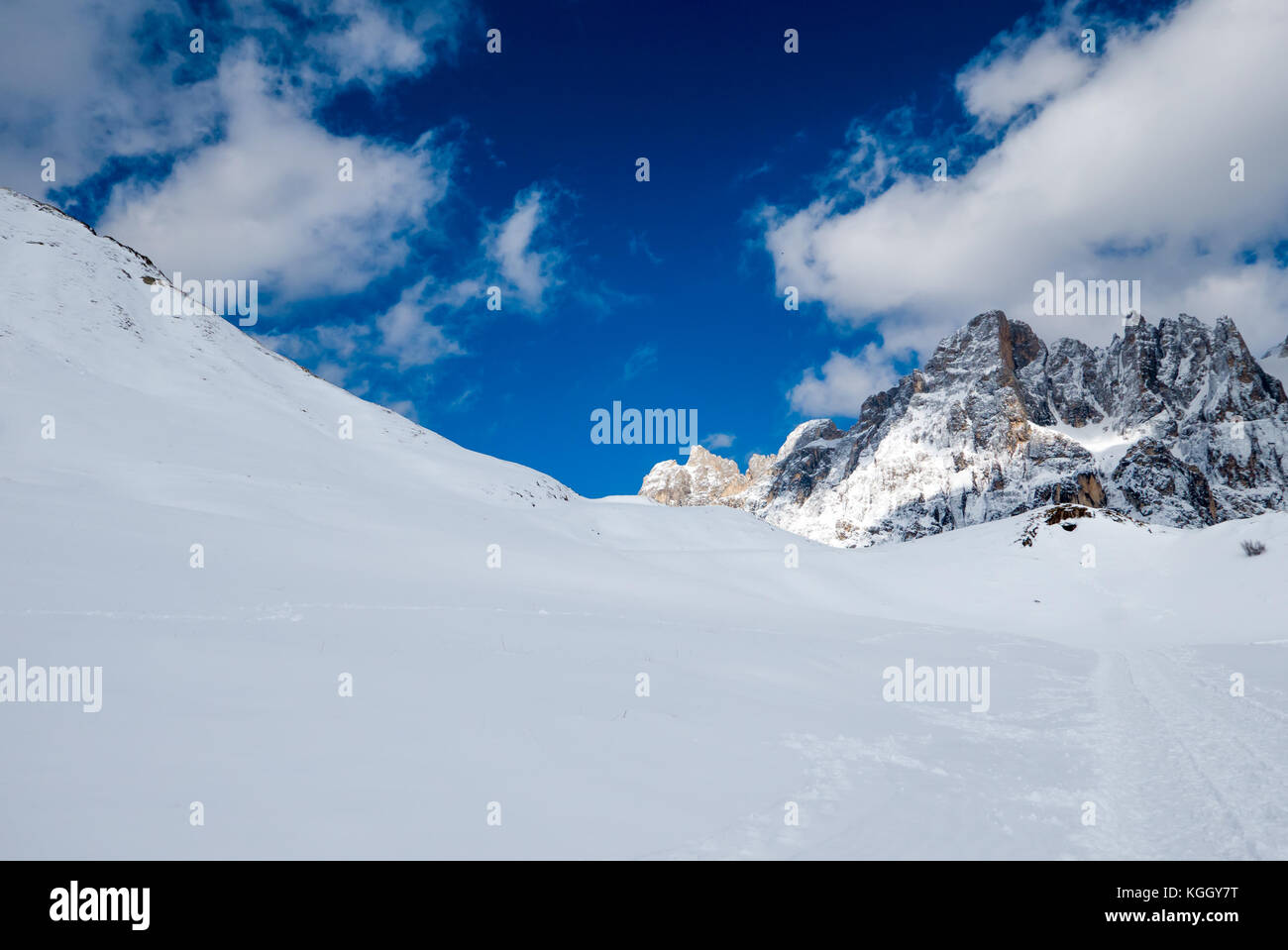 Scenic sunny snowy mountains, light reflections and shadows over winter ...