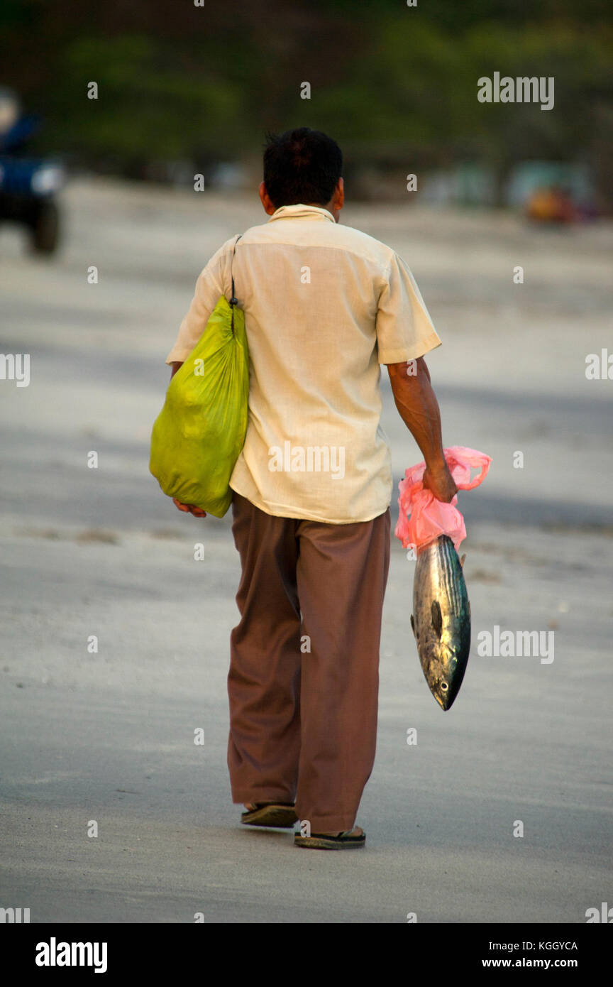 Fisherman returning home at sunset hi-res stock photography and images ...