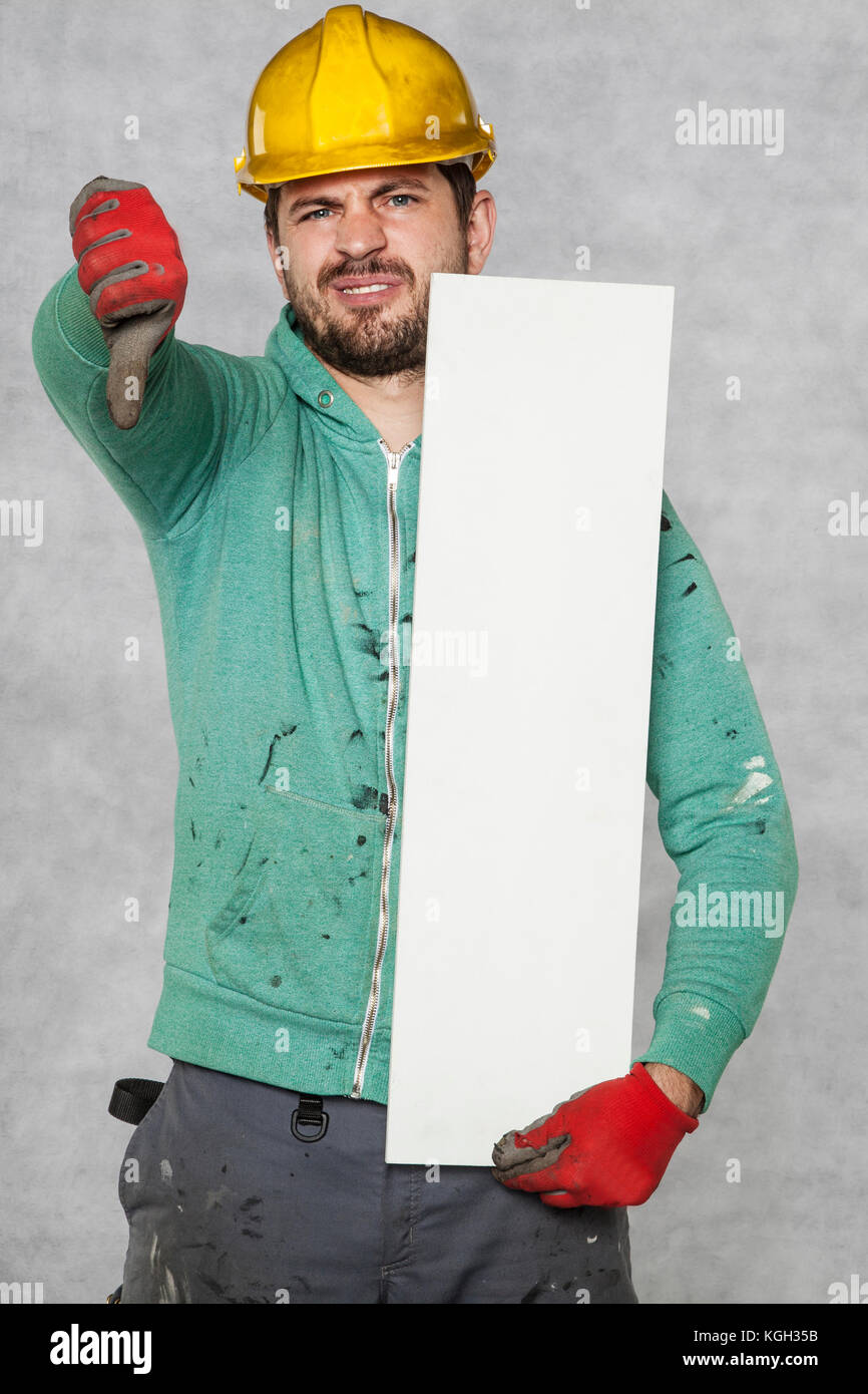 Happy worker shows ad hi-res stock photography and images - Alamy