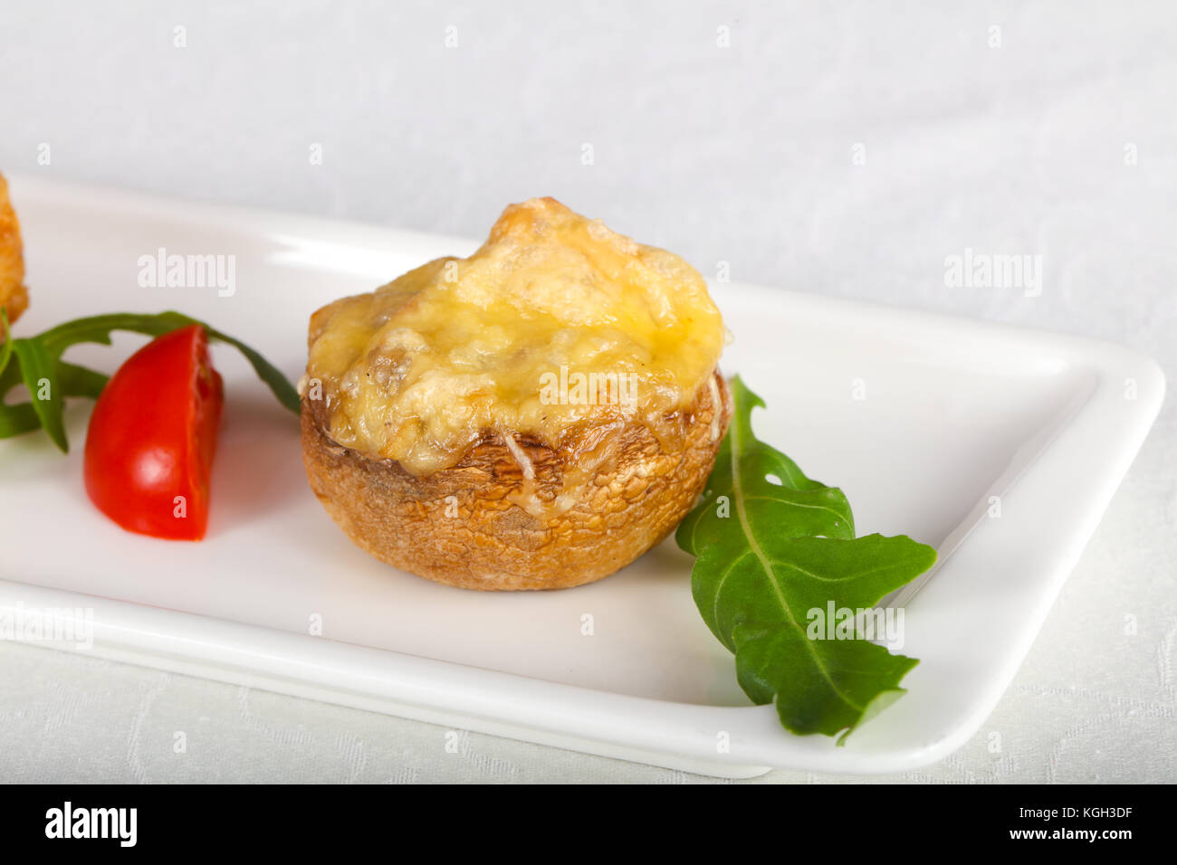 Baked mushrooms champignon with cheese Stock Photo - Alamy