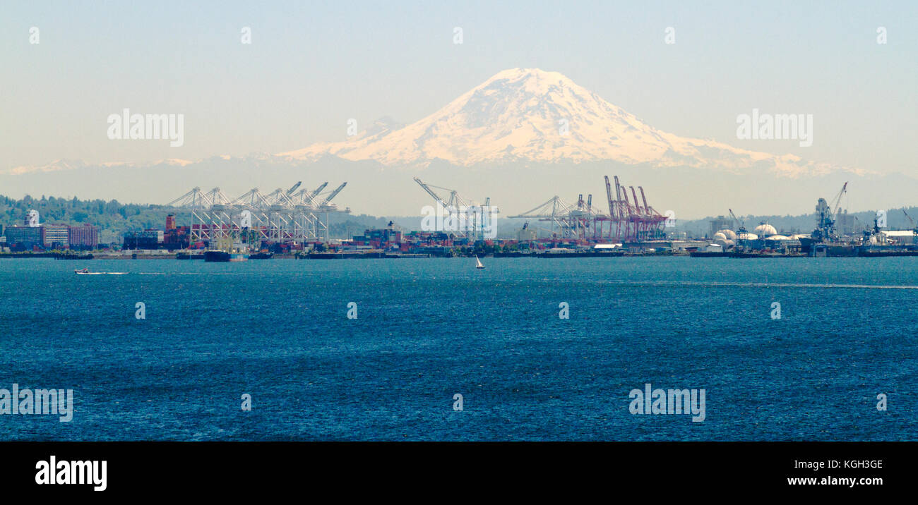 Loading area for freighters seen from offshore with Mt. Rainier looming ...
