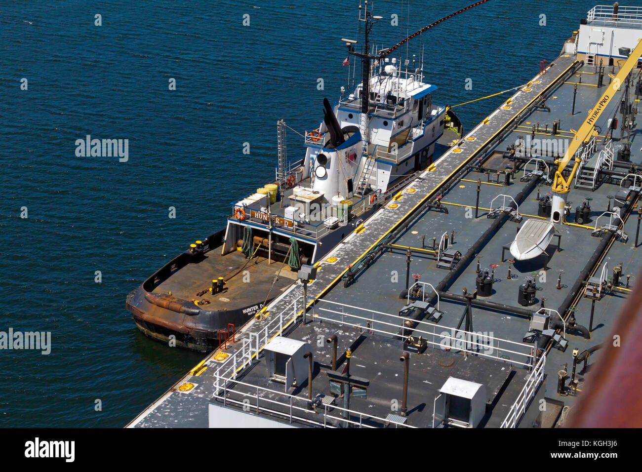 Elevated view of a tugboat docked to a pier in Seattle, Washington ...