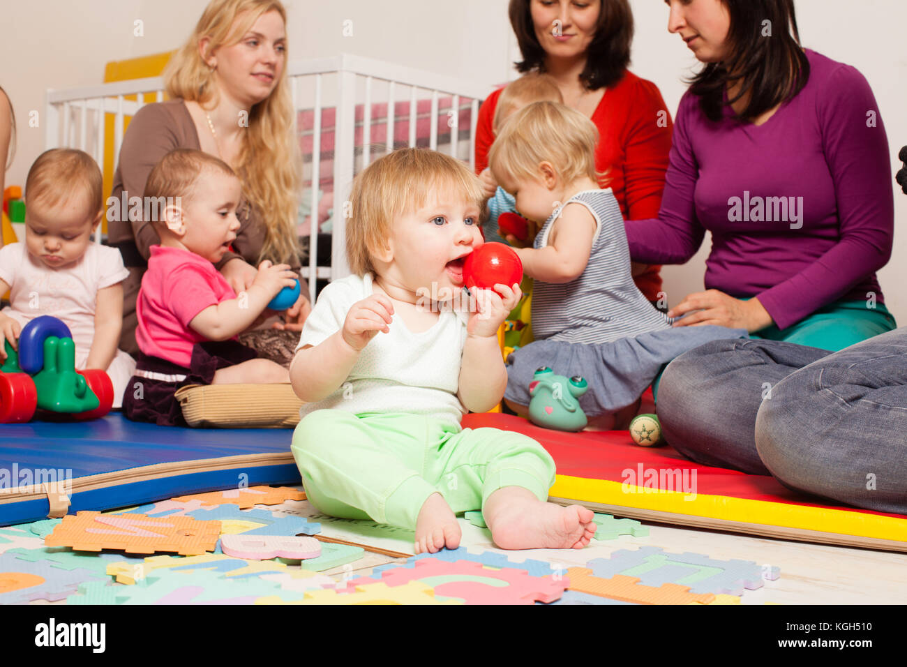 Group of mothers with their babies Stock Photo - Alamy