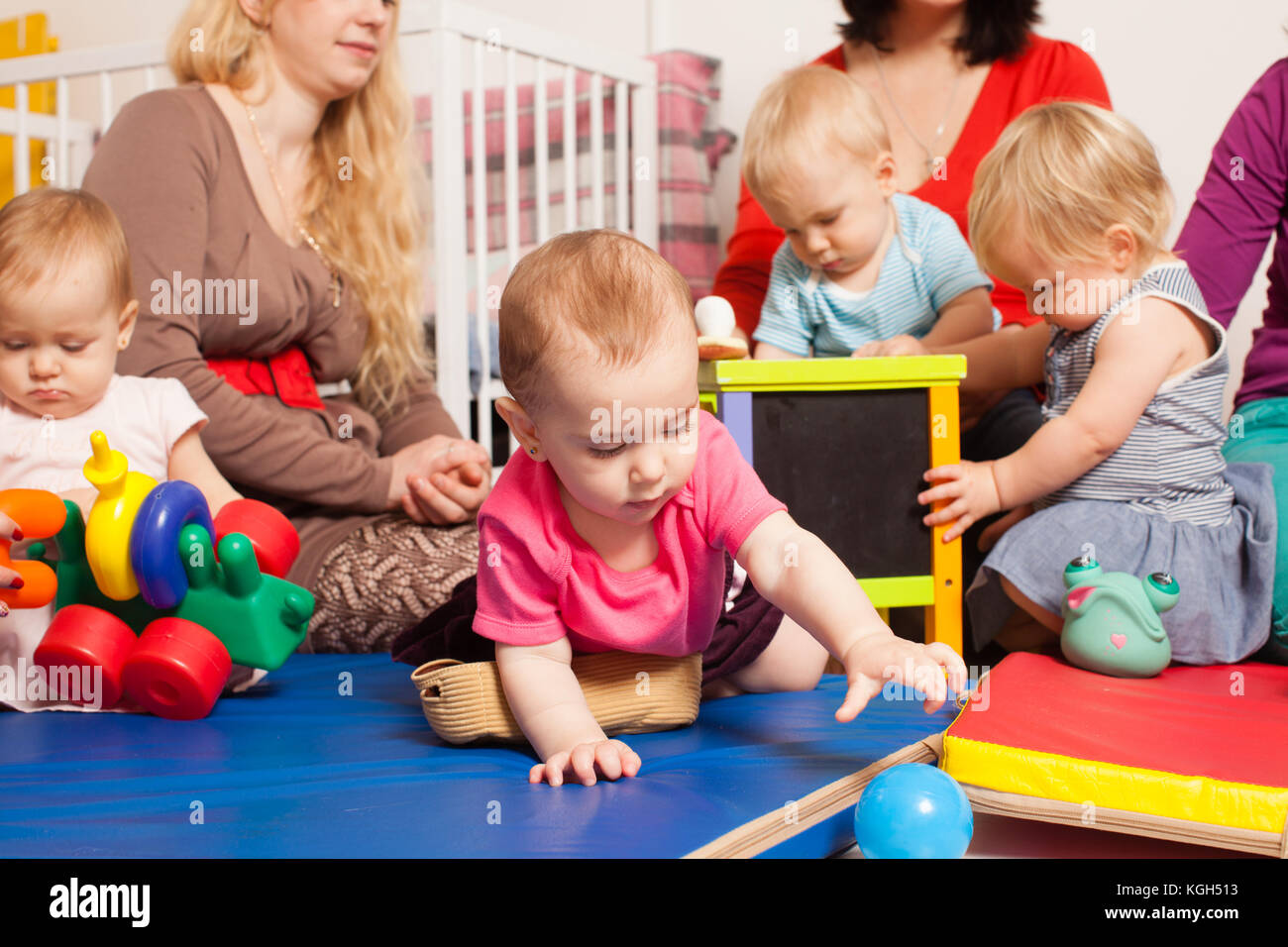 Group of mothers with their babies Stock Photo - Alamy