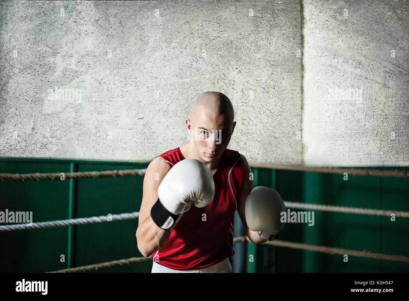 portrait of male boxer standing in the ring Stock Photo - Alamy