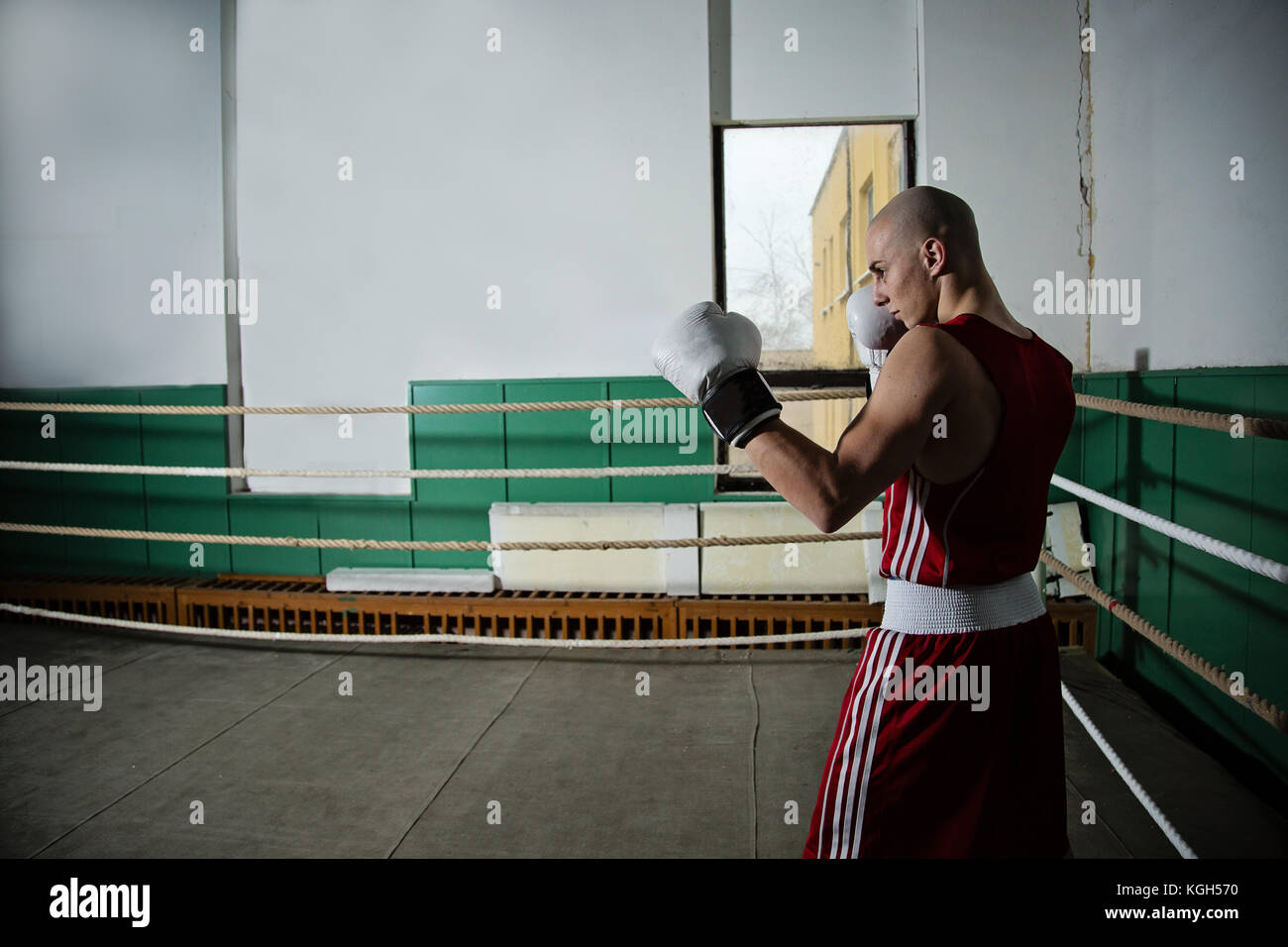 portrait of male boxer standing in the ring Stock Photo - Alamy
