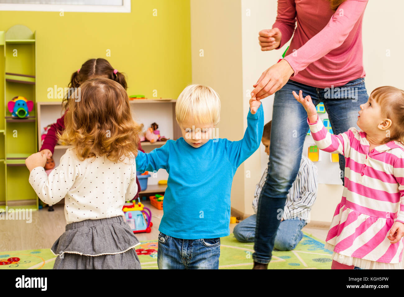 Group of little children dancing Stock Photo - Alamy