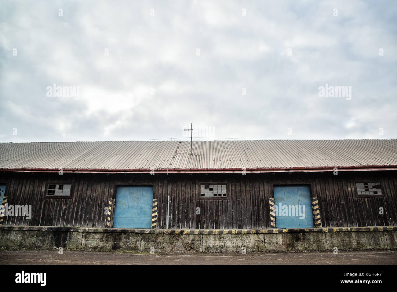 old wooden building view from a front with dramatic sky Stock Photo - Alamy