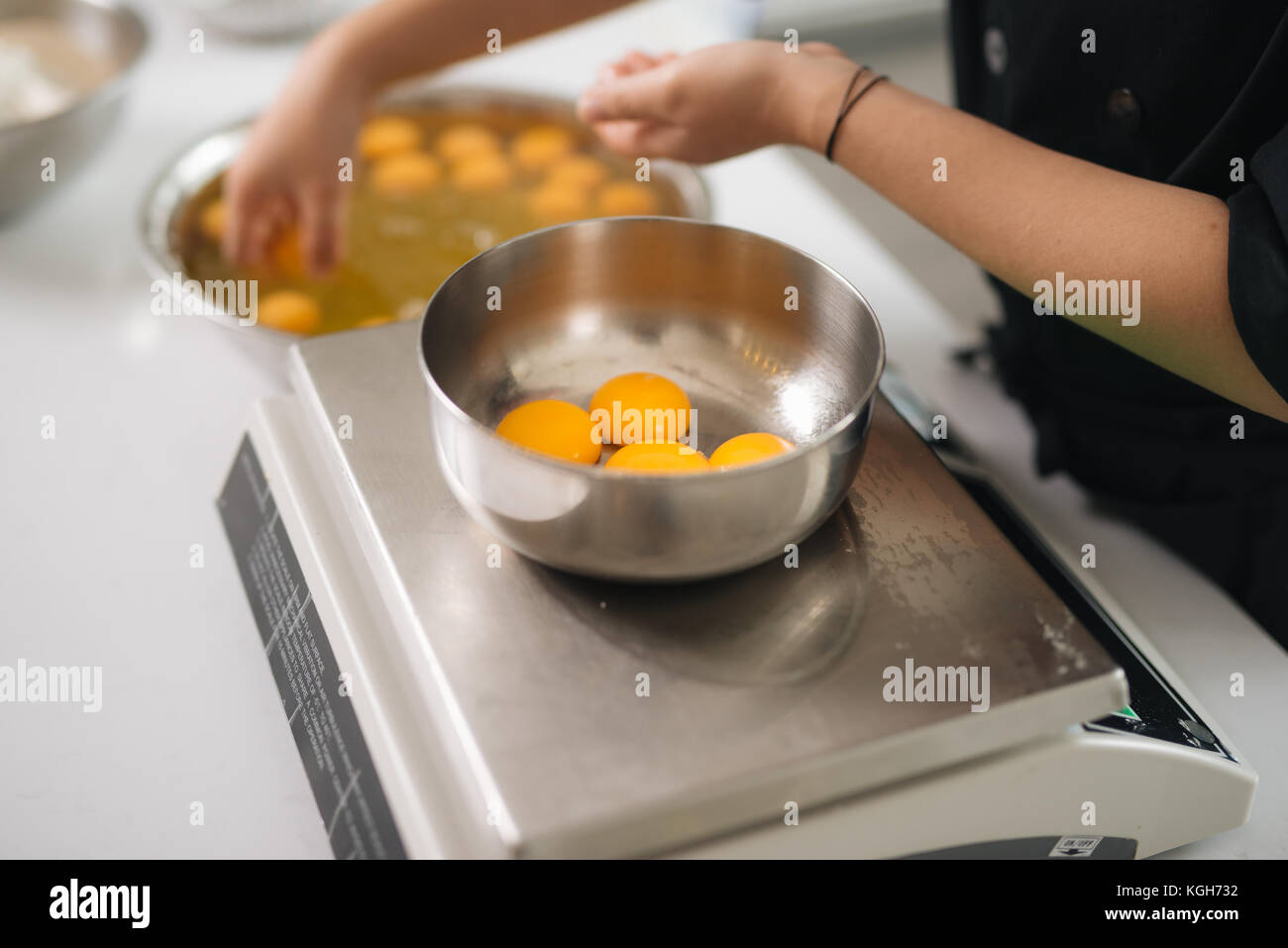 Bakery chef cooking bake in the kitchen professional Stock Photo - Alamy