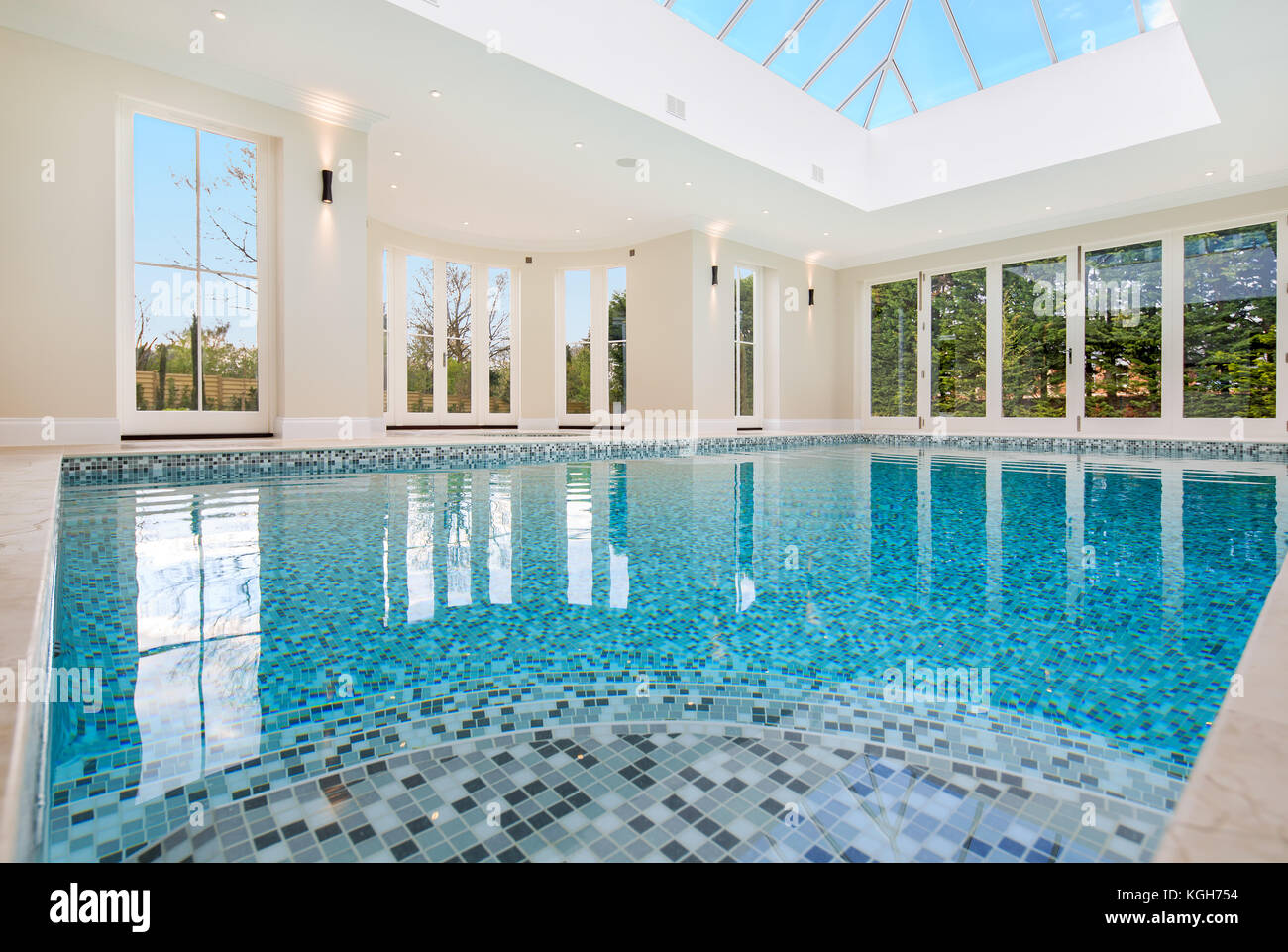 Indoor pool complex in large country home Stock Photo - Alamy