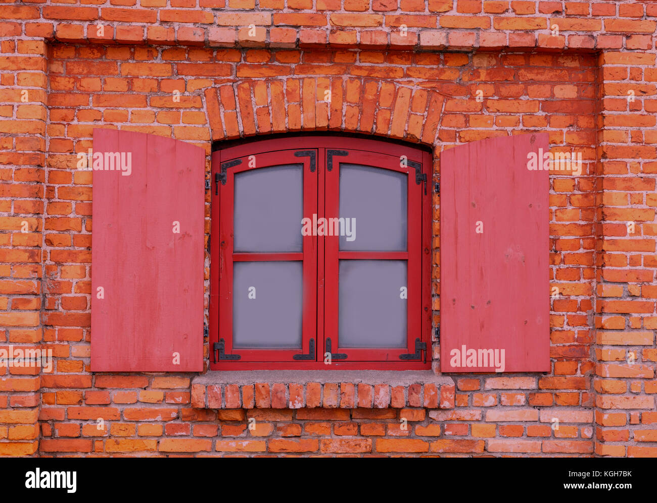 Red window on the facade of the old brick house Stock Photo - Alamy