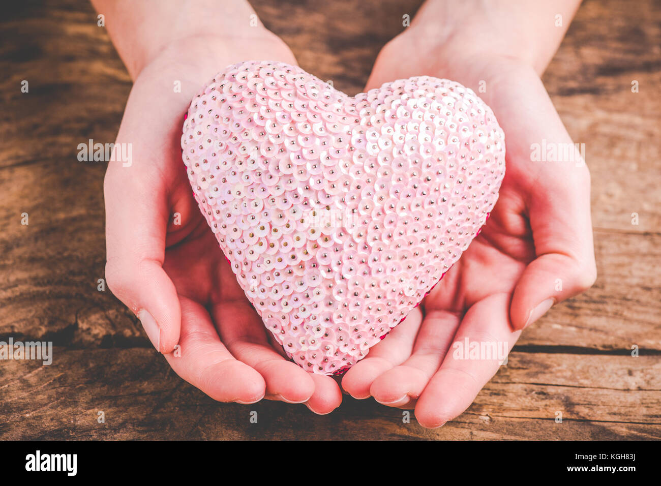with heart in hands Stock Photo - Alamy
