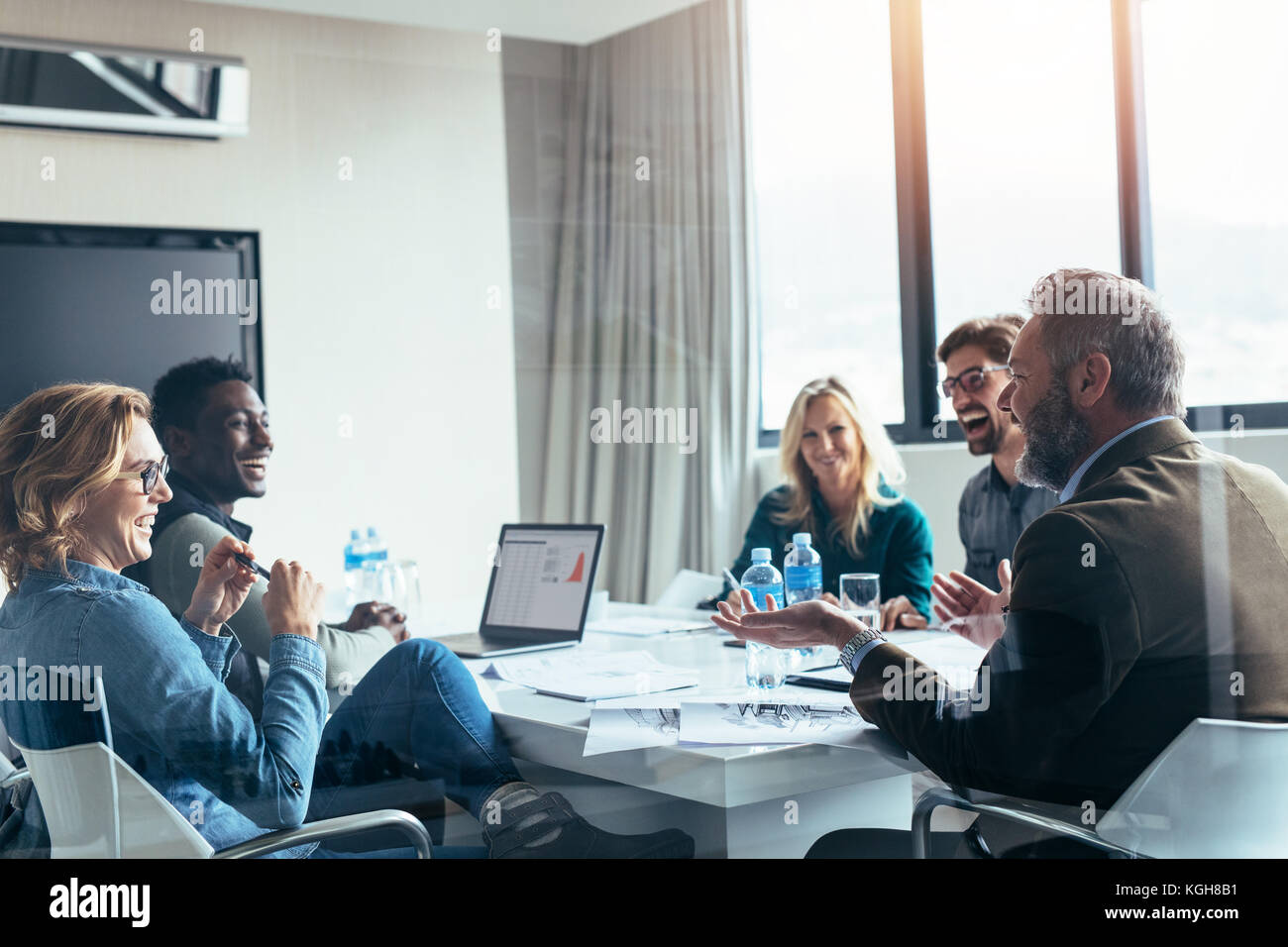 Five businesspeople boardroom table hi-res stock photography and images ...