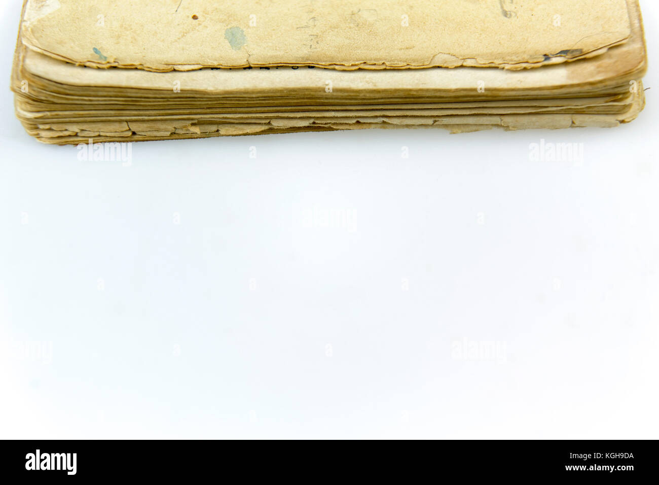 Old antique book with bent page edges on white. Vintage print ...