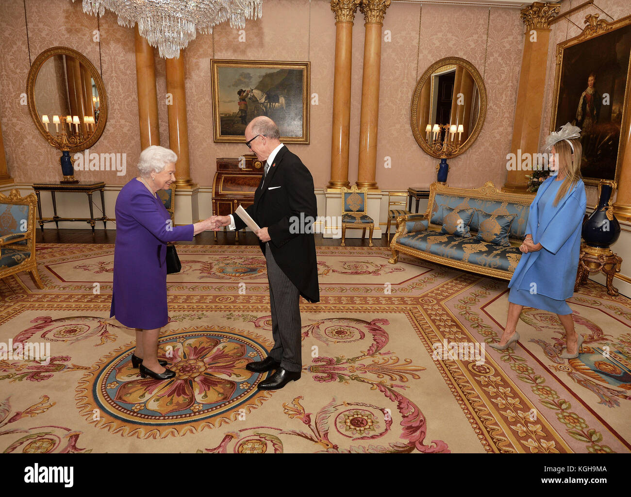 Queen Elizabeth II shakes hands with Woody Johnson, the US Ambassador ...