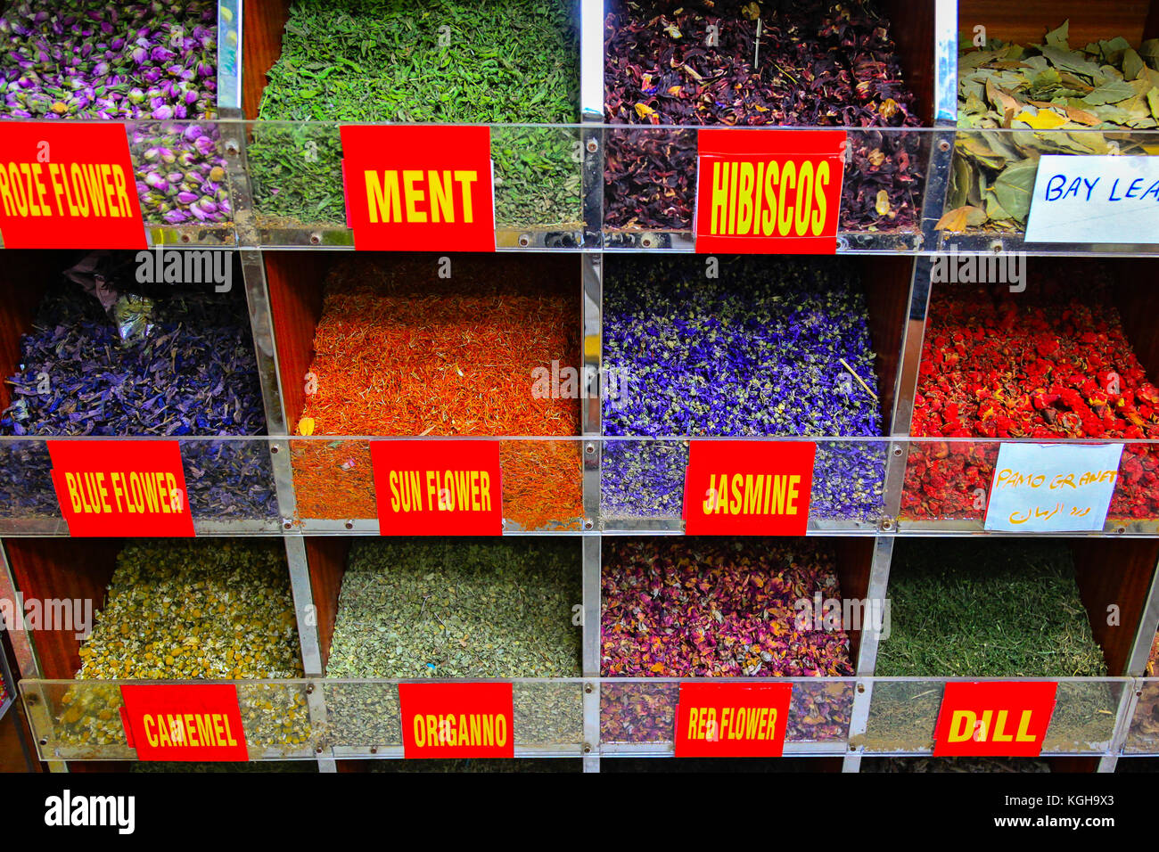 Shelves of various spices - rose flower, mint, hibiscus, bay leaf, blue ...