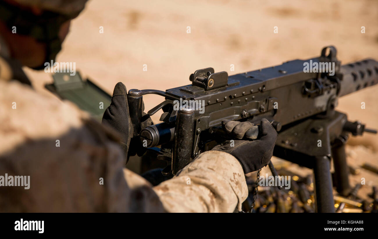 A U.S. Marine with Marine Aircraft Group 31 fires an M2 machine gun ...