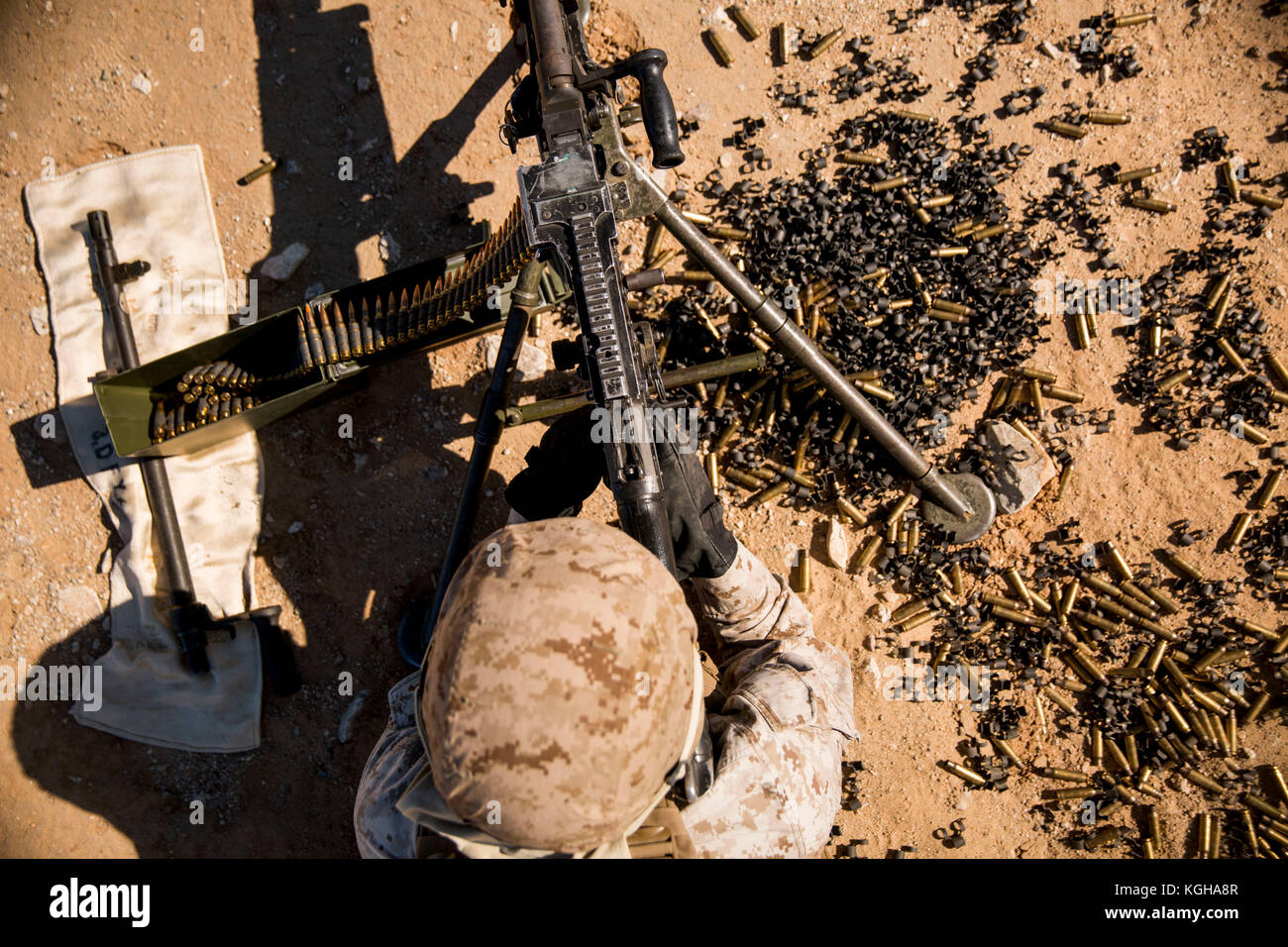 A U.S. Marine with Marine Aircraft Group 31 fires an M240b machine gun ...