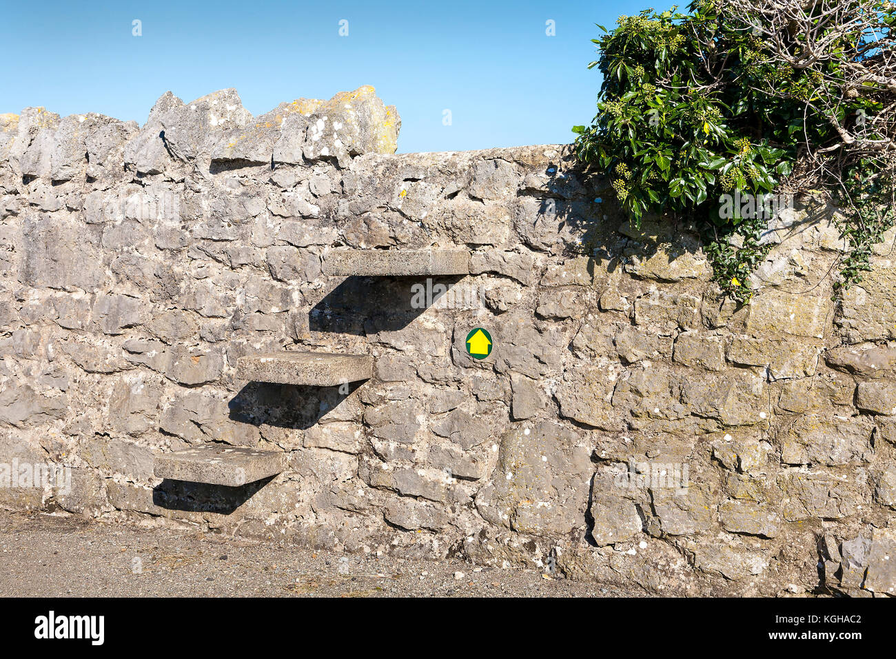 Steps built in to a stone wall to enable people to climb over and ...