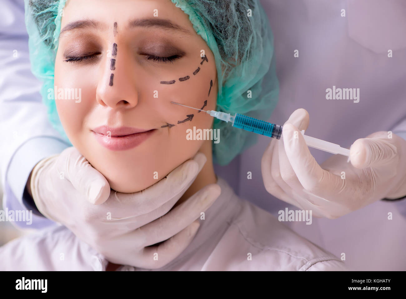 Plastic surgeon preparing for operation on woman face Stock Photo - Alamy