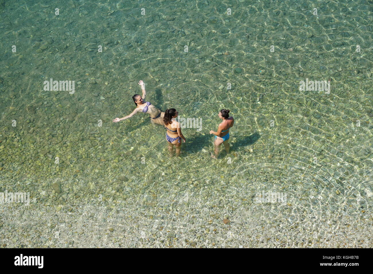 Corfu, Greece: People in the sea at the beach of Kerkyra Old Town Corfu ...