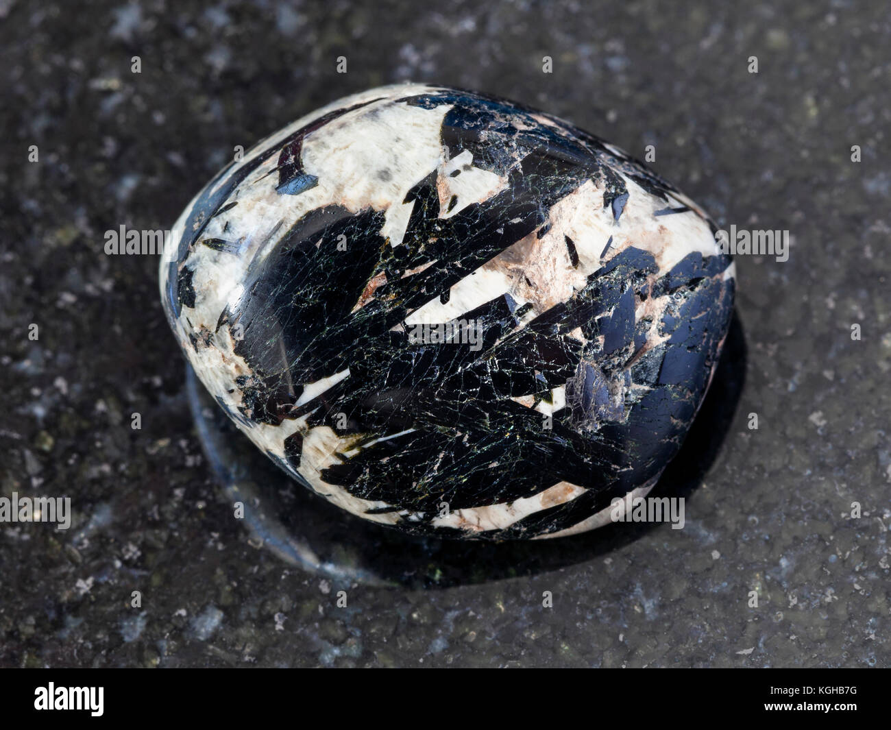 macro shooting of natural mineral rock specimen - black aegirine ...