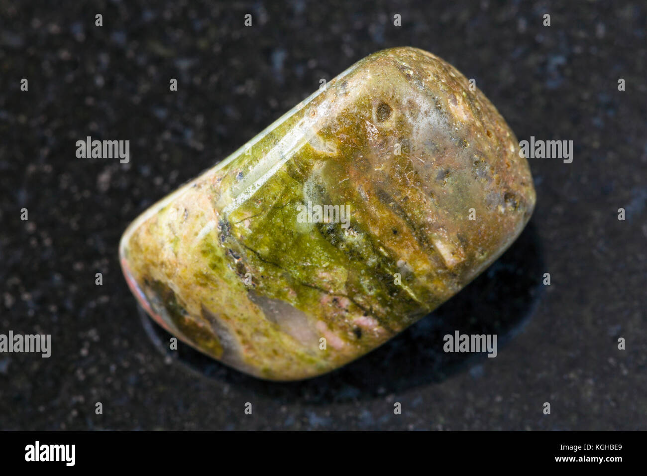 macro shooting of natural mineral rock specimen - tumbled unakite gem ...