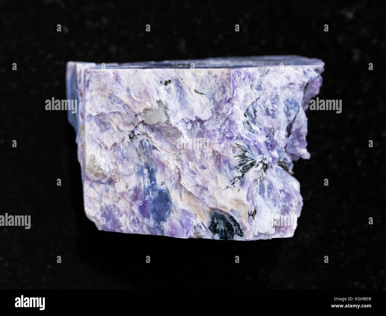 macro shooting of natural mineral rock specimen - rough charoite stone ...