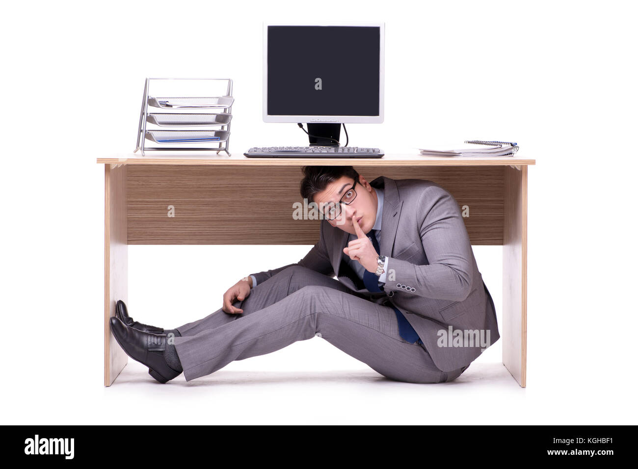 Person hiding under desk hi-res stock photography and images - Alamy
