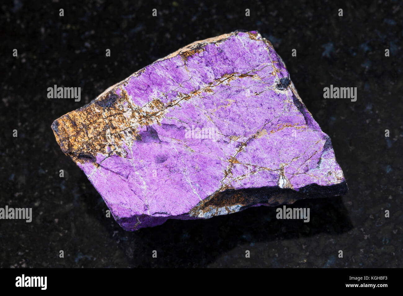 macro shooting of natural mineral rock specimen - raw Purpurite stone ...