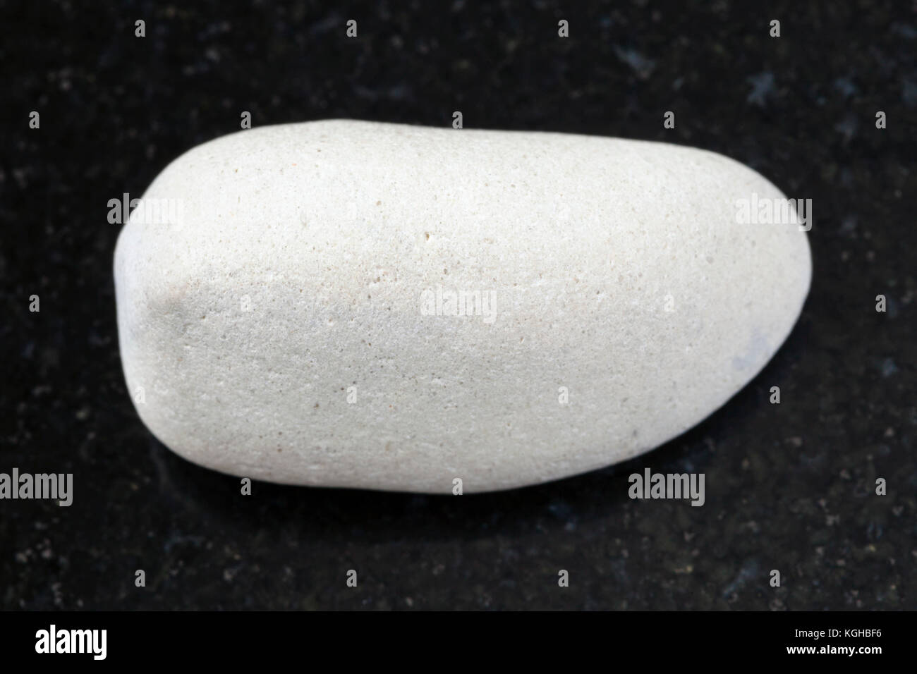 macro shooting of natural mineral rock specimen - tumbled white ...