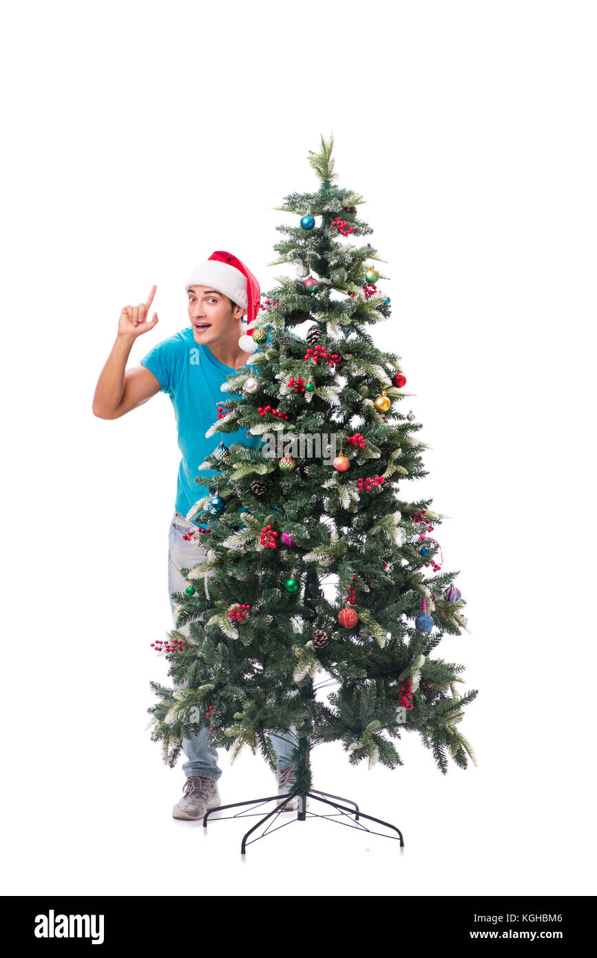 Young man decorating christmas tree isolated on white Stock Photo - Alamy