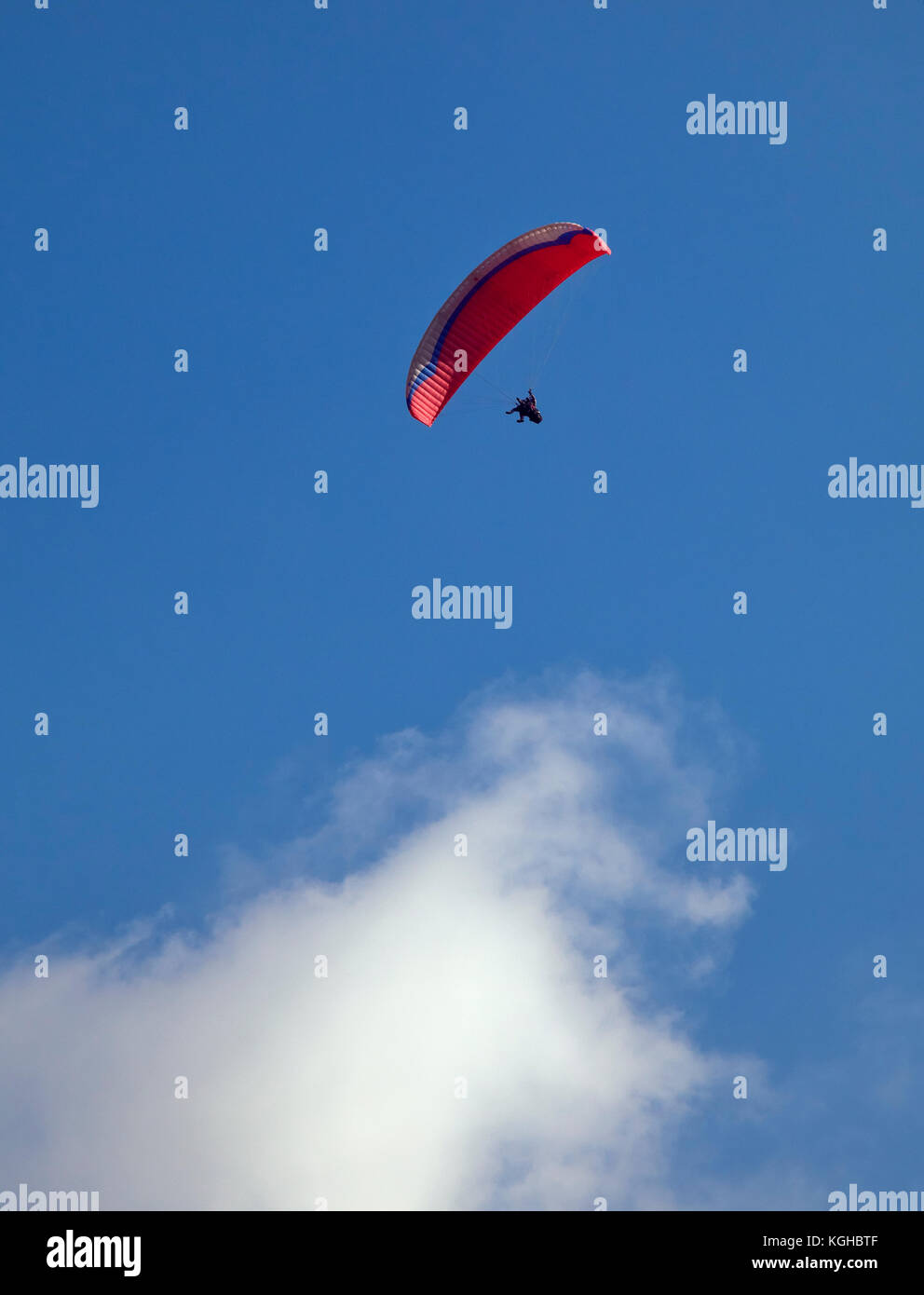 Parasailing in a blue sky Stock Photo - Alamy