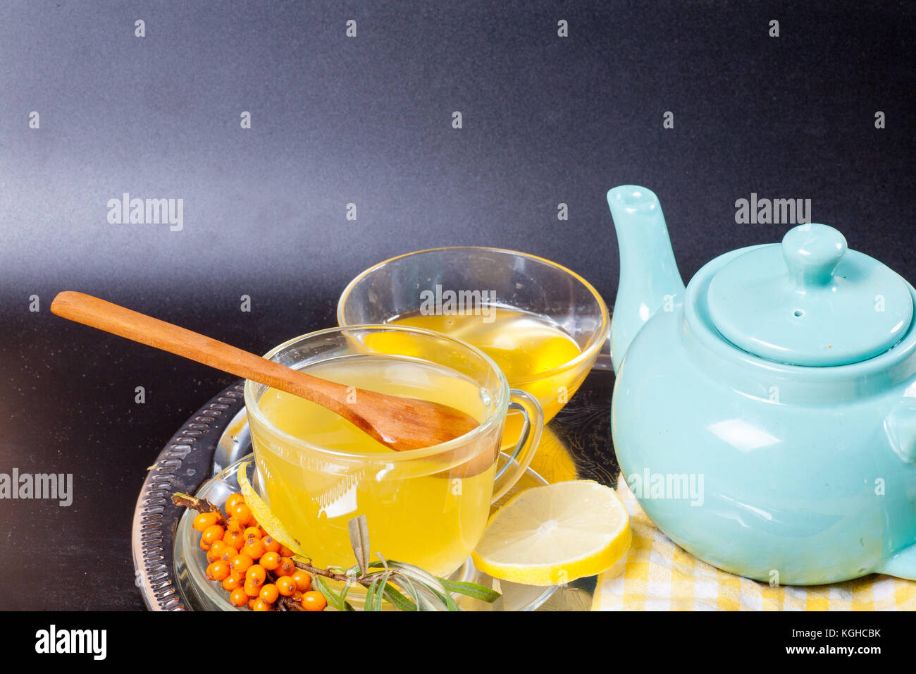 tea with sea-buckthorn on a black background Stock Photo - Alamy