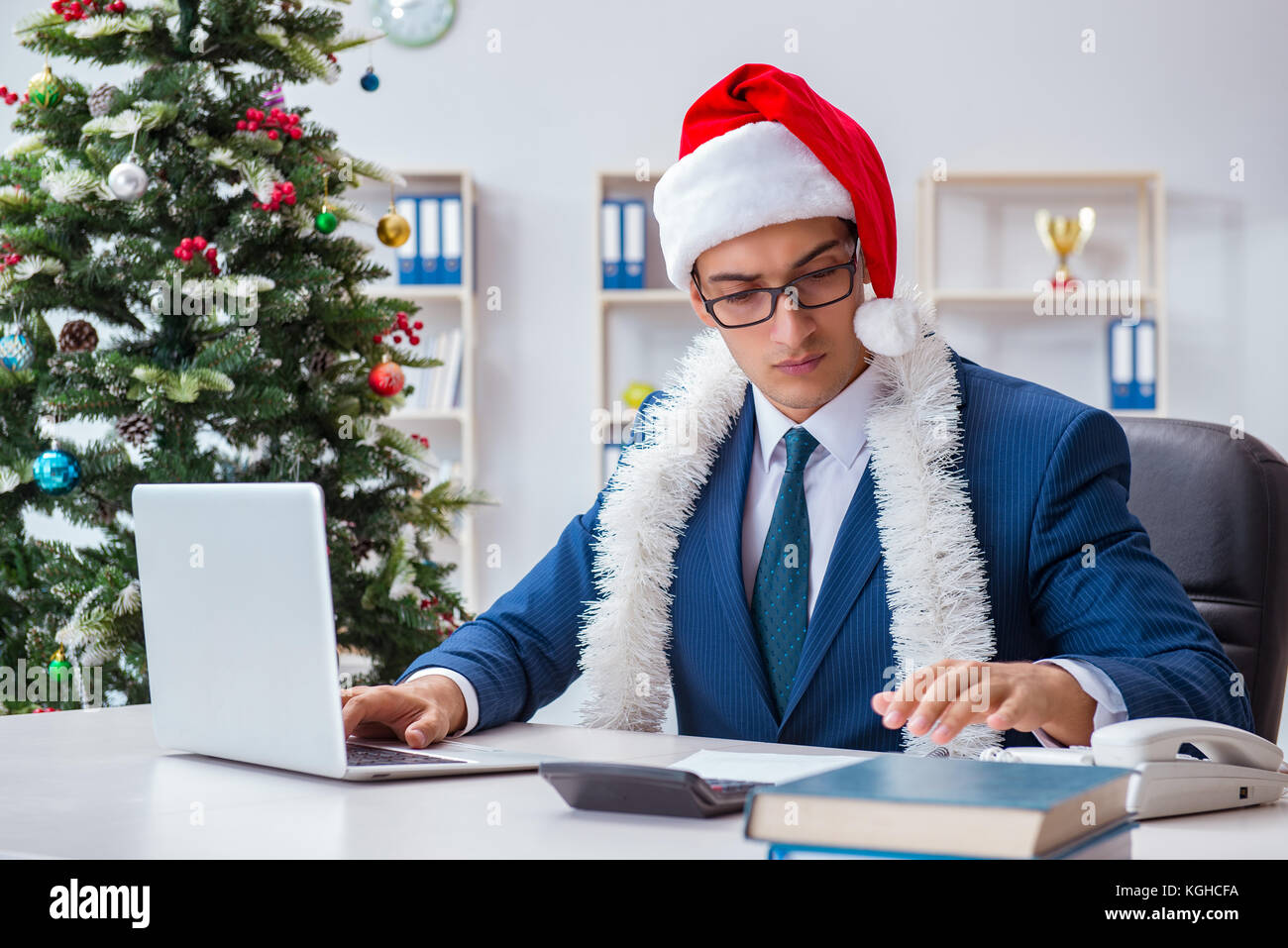 Businessman celebrating christmas holiday in the office Stock Photo - Alamy