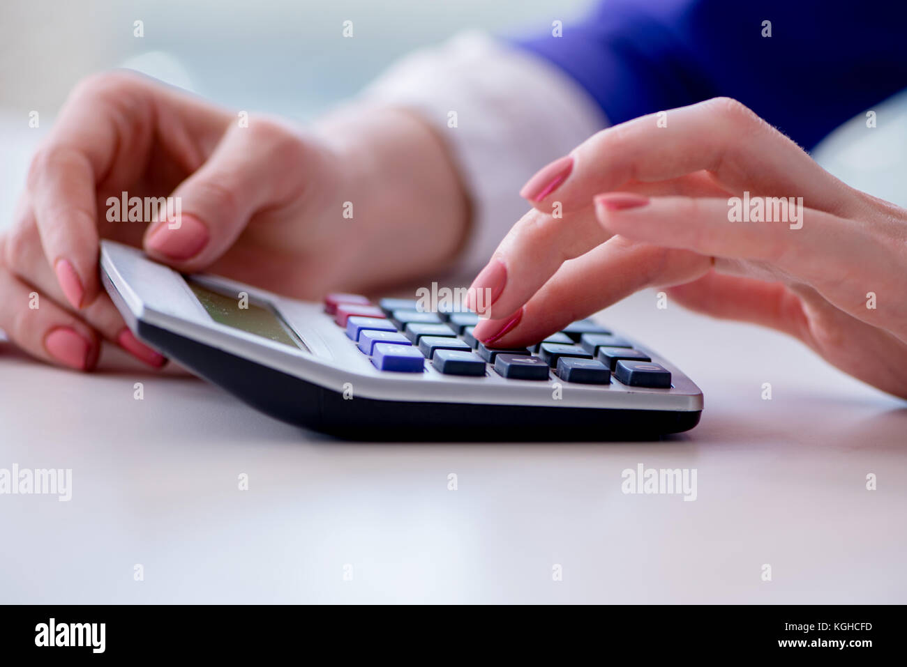 Hands working on accounting calculator calculating profit Stock Photo ...