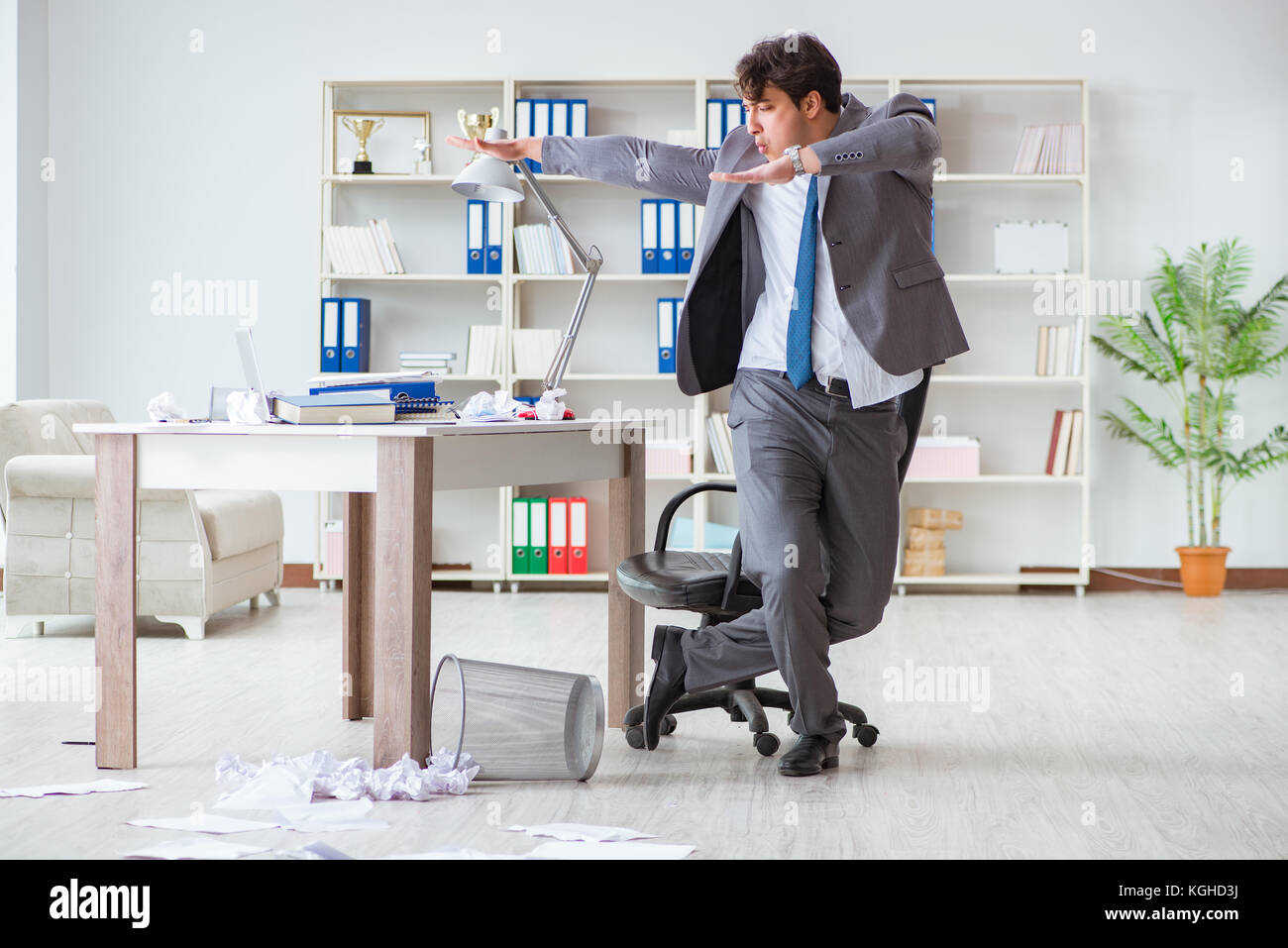 Businessman having fun taking a break in the office at work Stock Photo ...