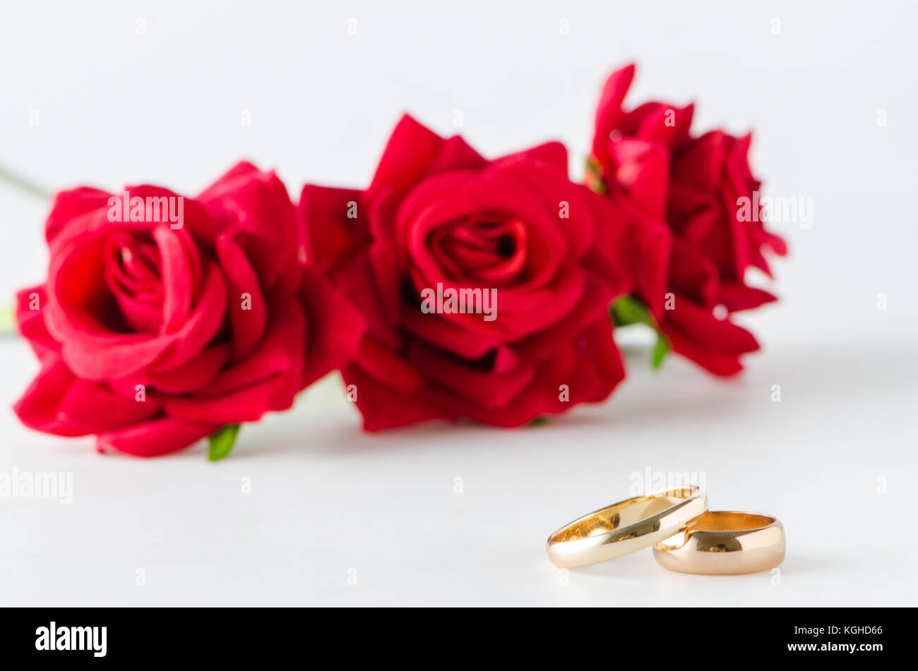 Wedding concept with rings and roses Stock Photo - Alamy