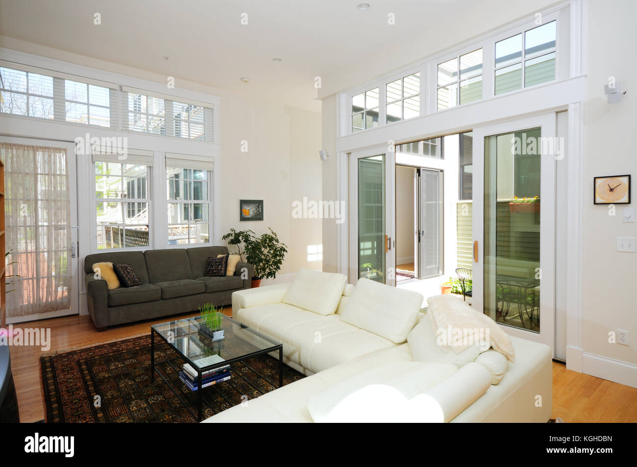 Lining room and atrium in modern open floor plan townhouse apartment ...