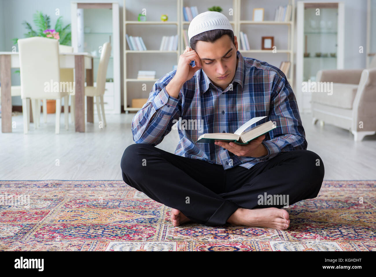 Young muslim man praying at home Stock Photo - Alamy