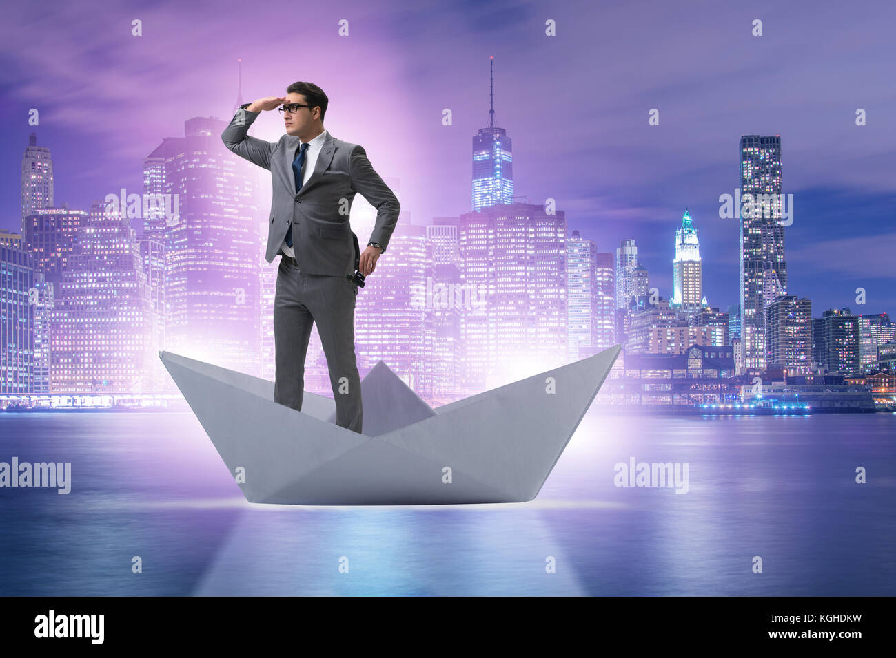 Businessman looking into future with binoculars in paper ship boat ...