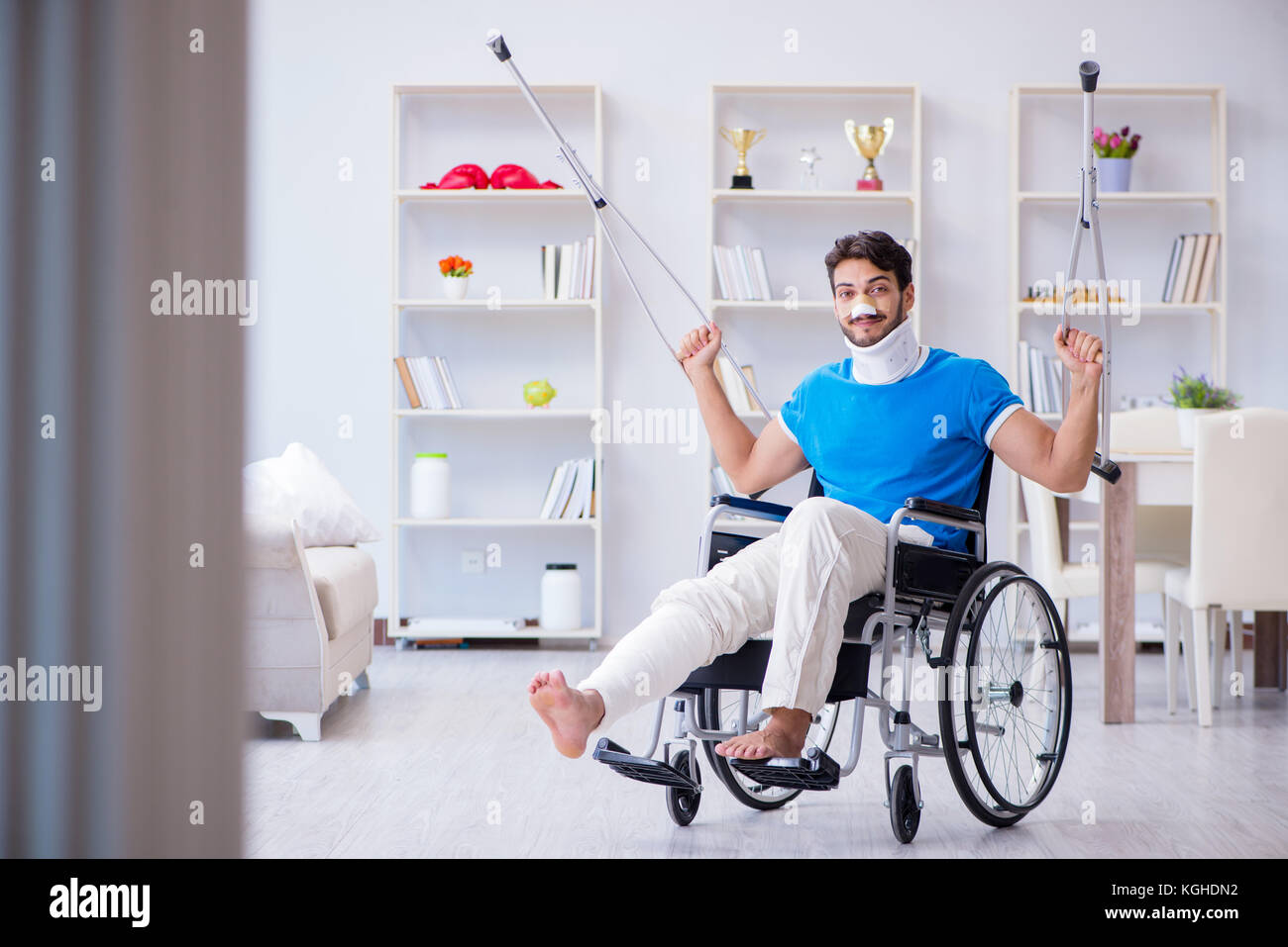 Injured young man recovering at home Stock Photo - Alamy