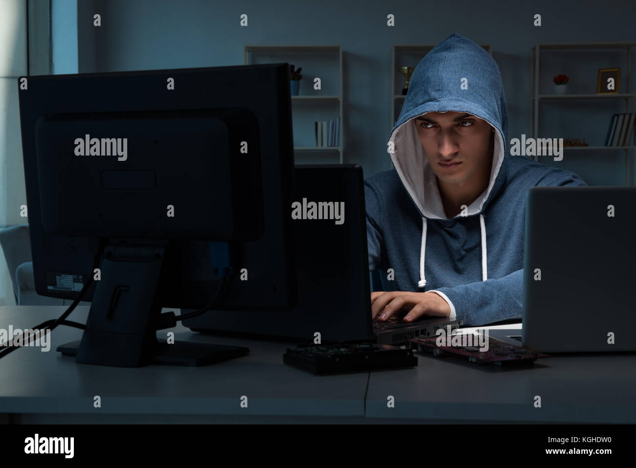 Hacker hacking computer at night Stock Photo - Alamy
