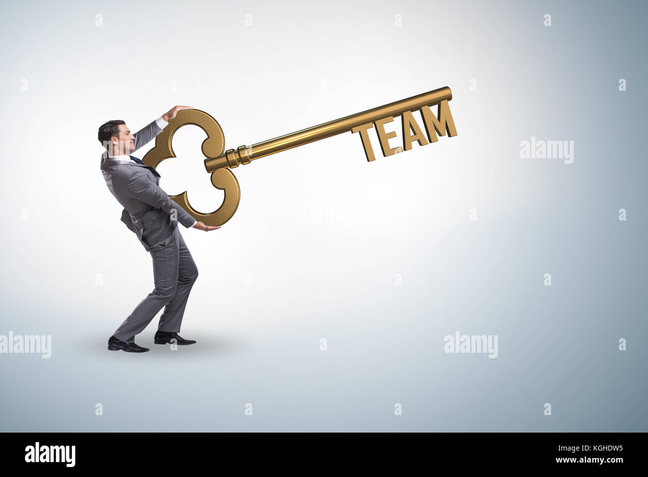 Businessman with key in teamwork concept Stock Photo - Alamy