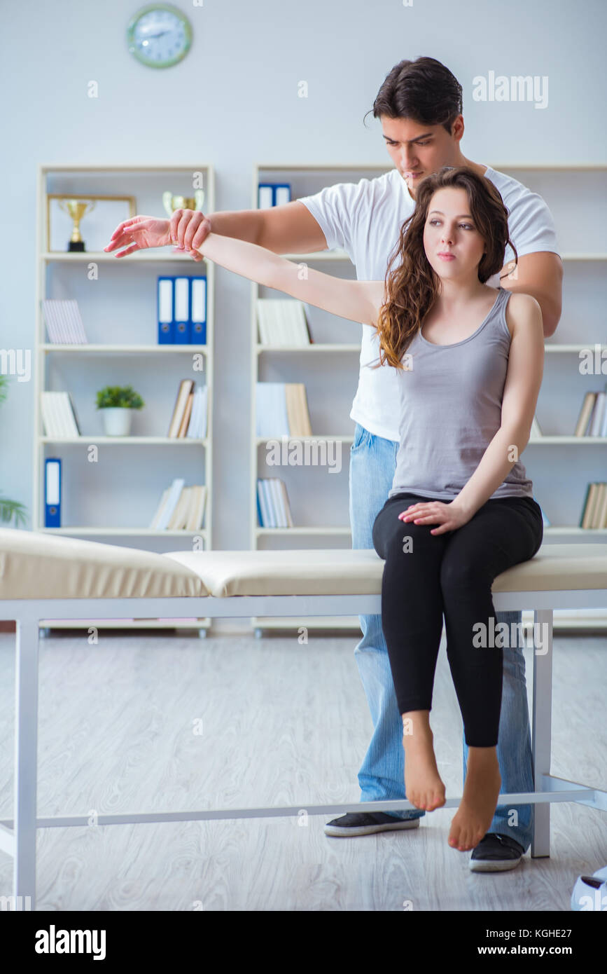 Young doctor chiropractor massaging female patient woman Stock Photo ...